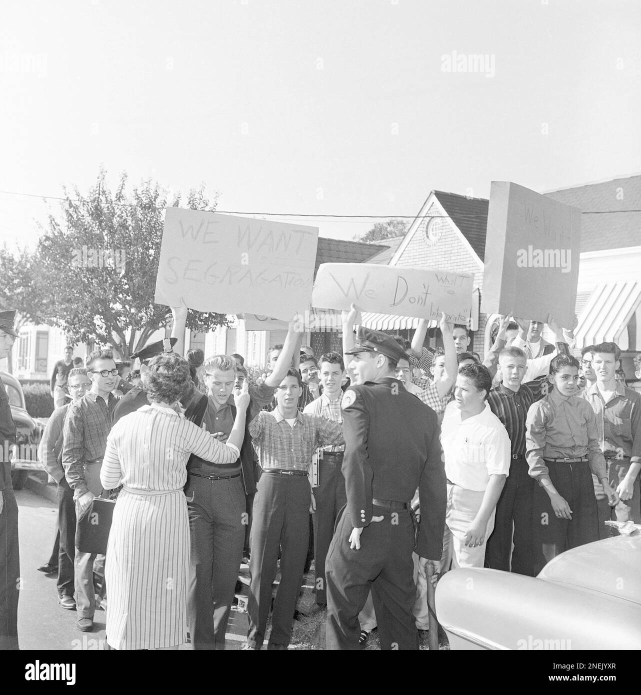 With two signs for segregation a crowd gathers outside the William ...