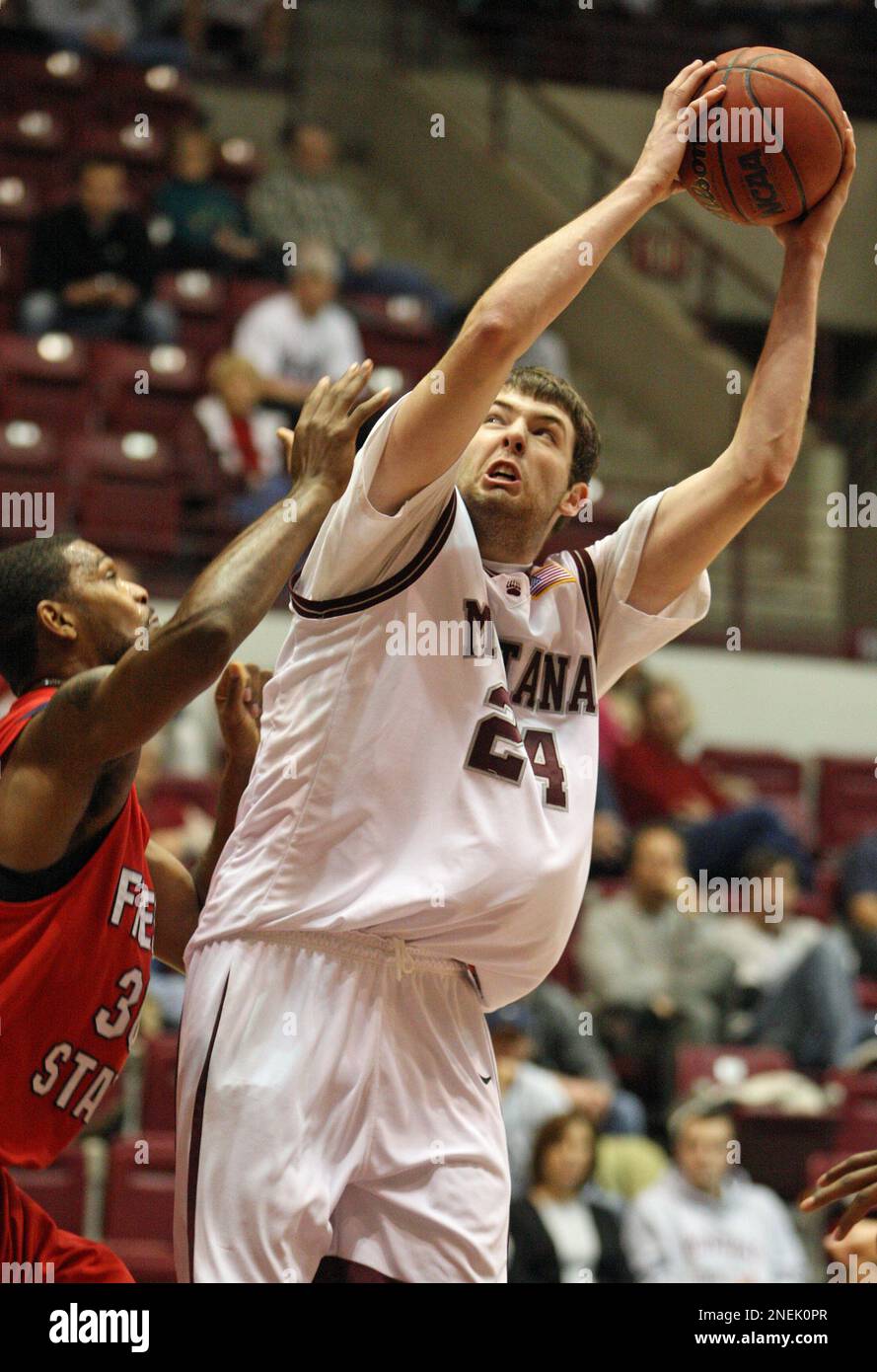 Montana forward Derek Selvig (24) jumps for a rebound in front of ...