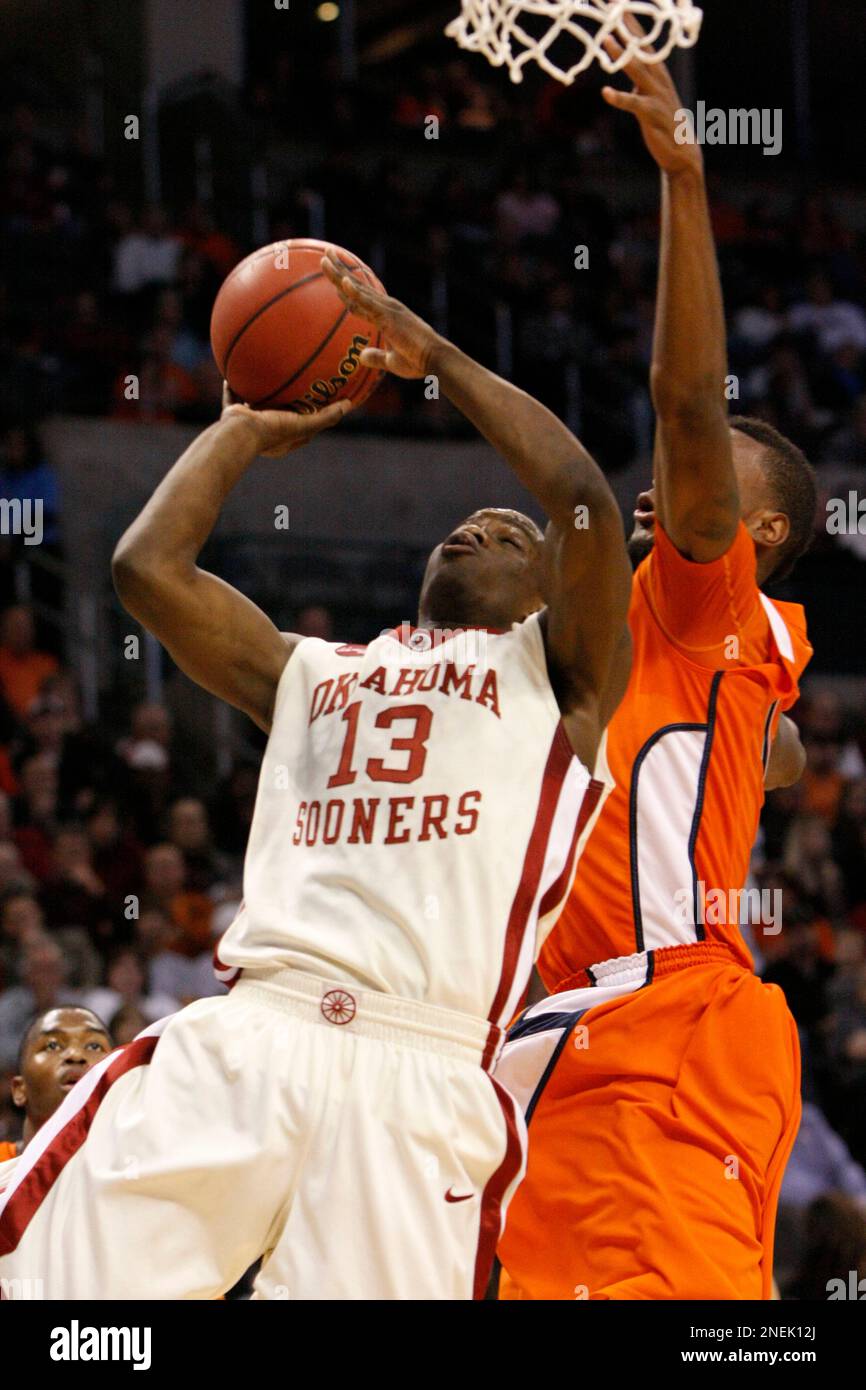 Oklahoma guard Willie Warren, left, goes to the basket in front of UTEP ...