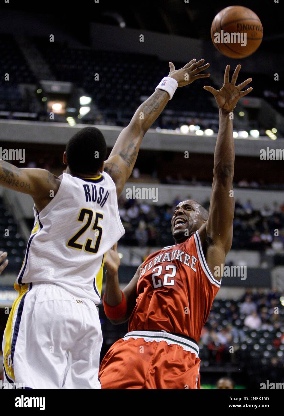 Milwaukee Bucks' Michael Redd, right, shoots over Indiana Pacers ...