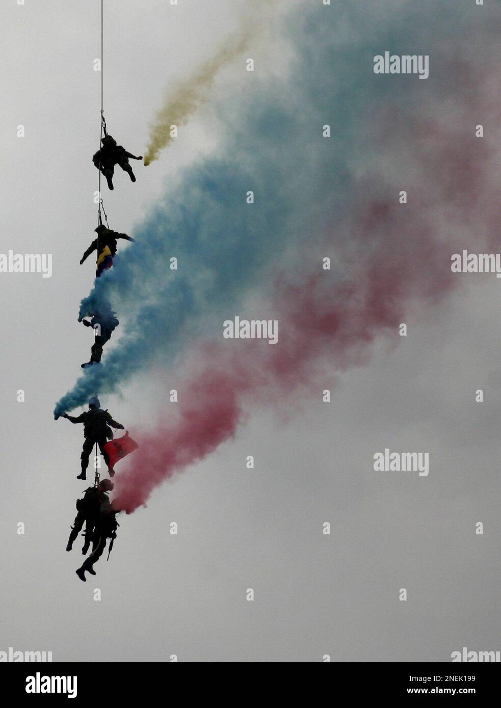 Soldiers display colored smoke trails with the colors of Colombian ...