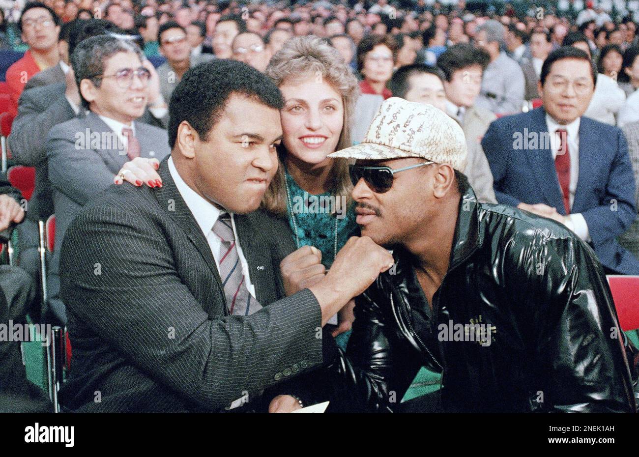 Former heavyweight world champion Muhammad Ali, left, clowns with ...