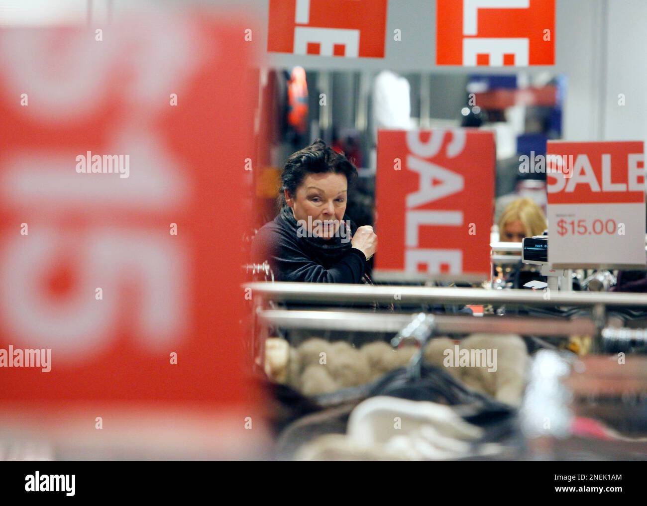 Sale signs are displayed inside a clothing store at the CambridgeSide ...