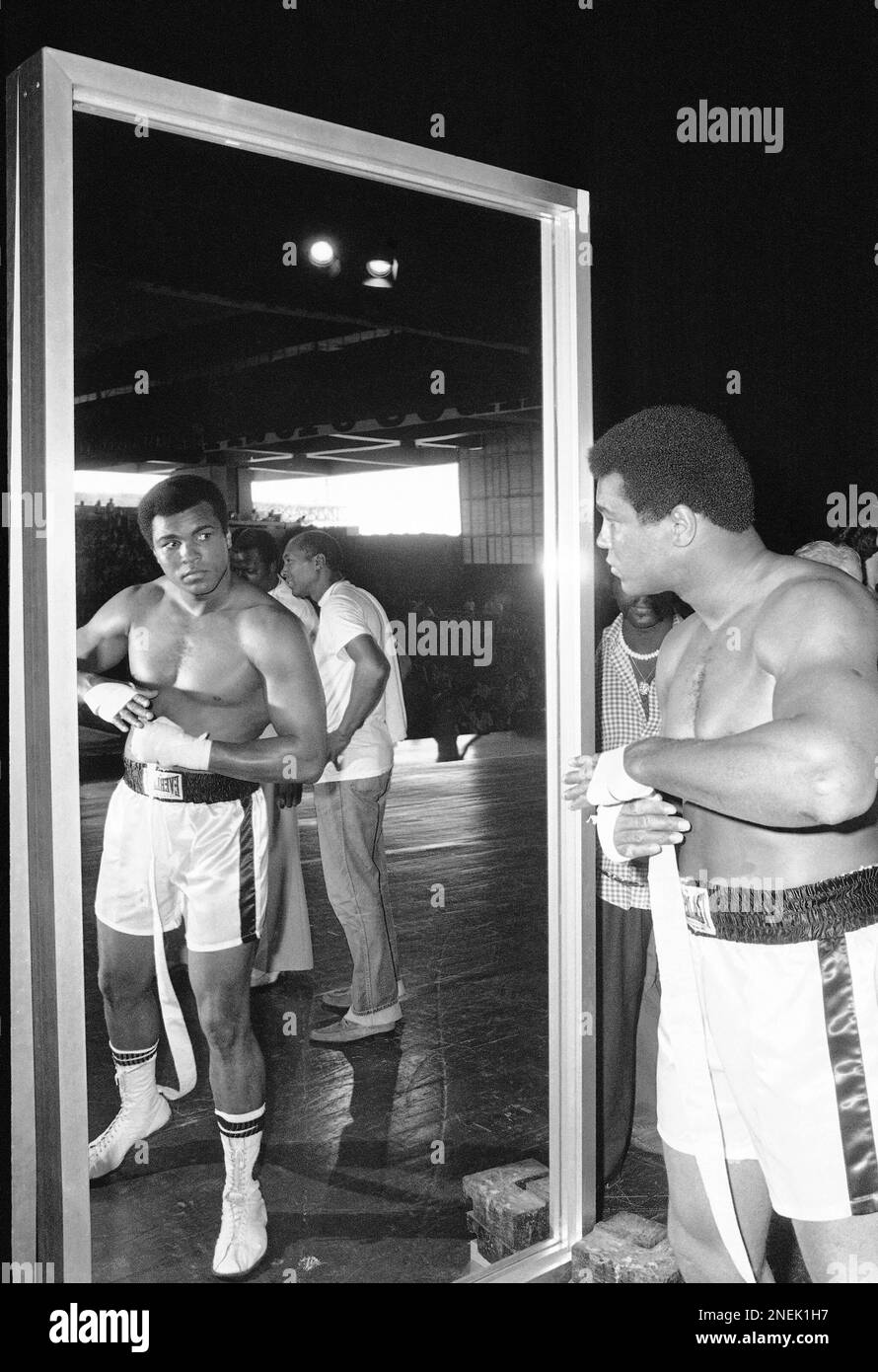 Muhammad Ali, world heavyweight champion, catches his image in mirror ...