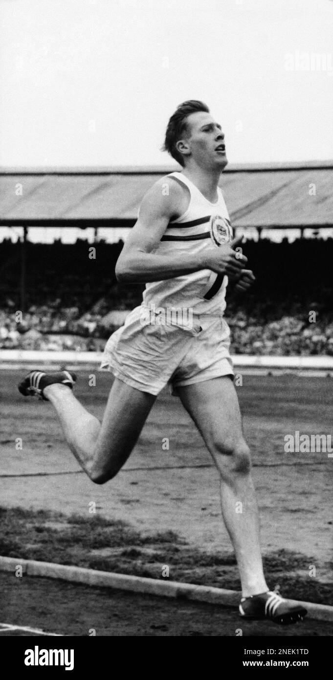 Roger Bannister finishing record-breaking win in the 880-yard event in ...