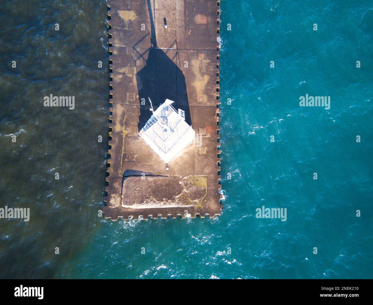 An aerial view of an observation white tower on a metal pier in the ...
