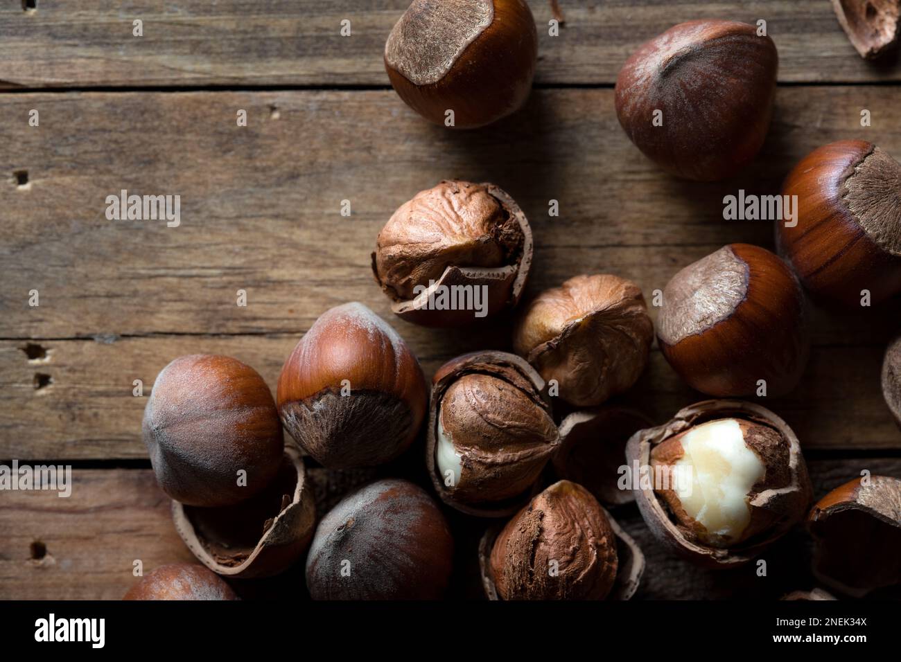 Unpeeled hazelnuts on wooden hi-res stock photography and images - Alamy