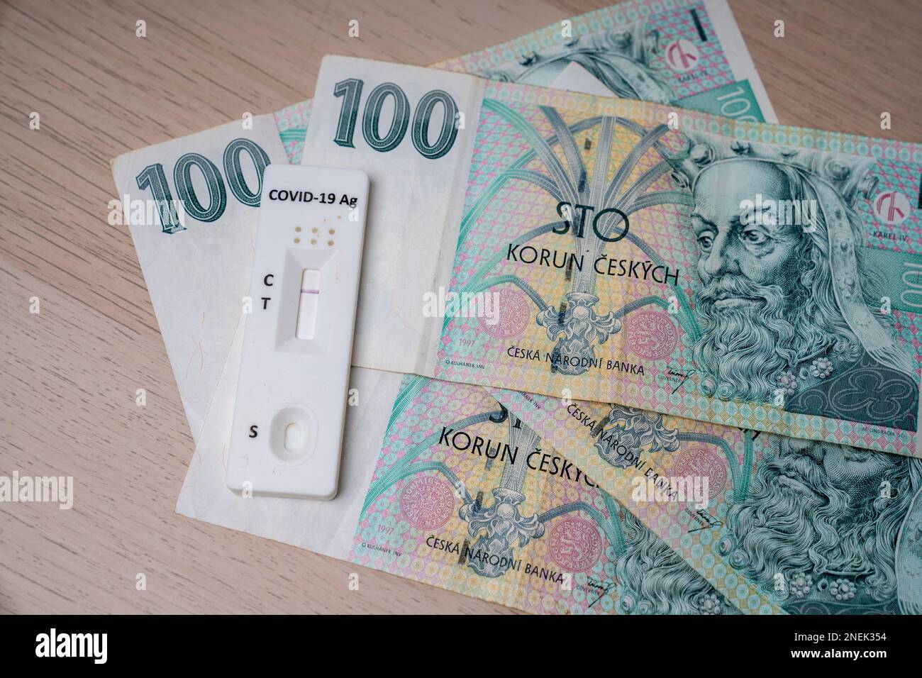 Czech Republic 100 korun paper banknote and a covid test Stock Photo ...