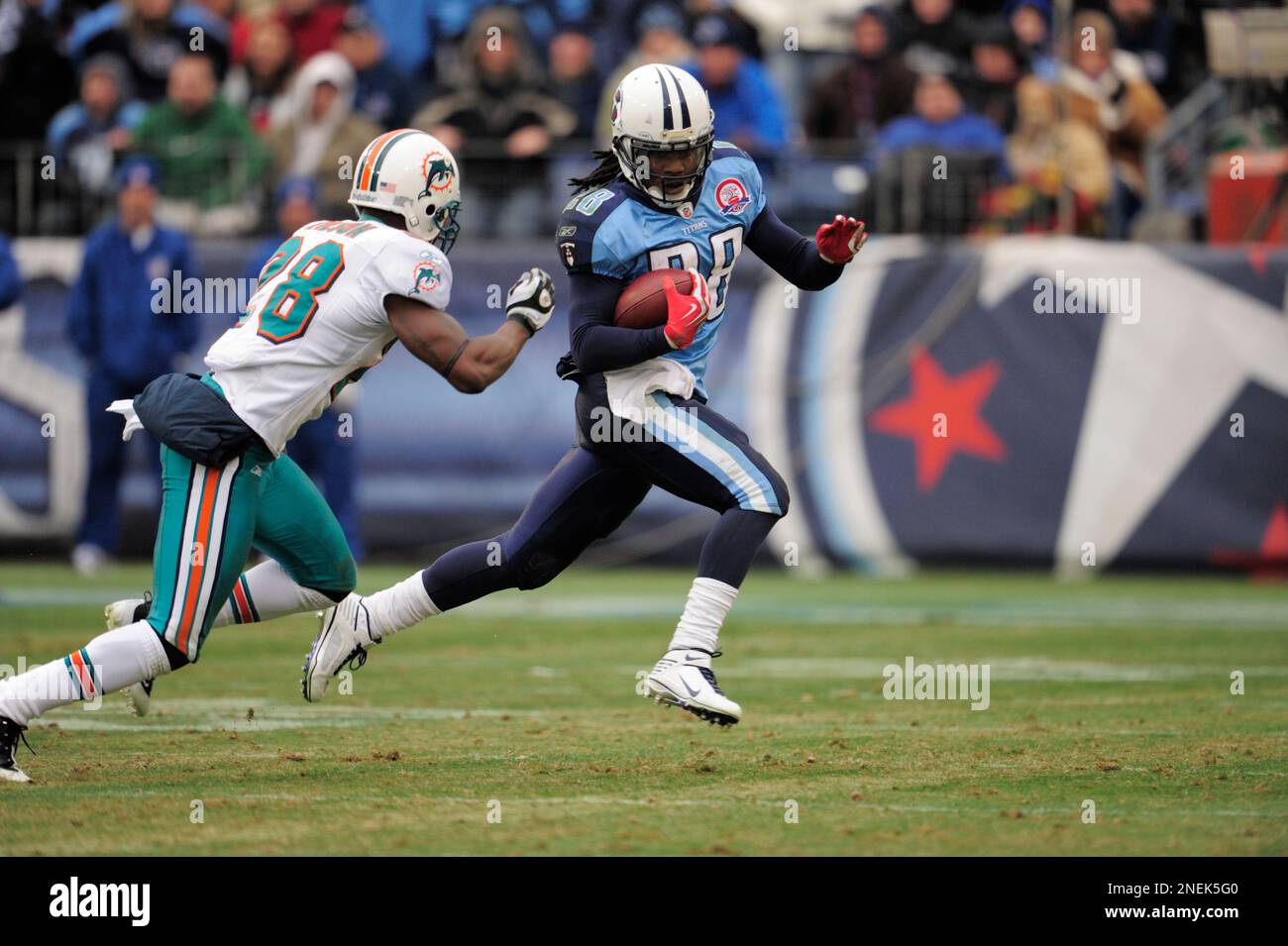 Tennessee Titans running back Chris Johnson, right, is chased by Miami ...