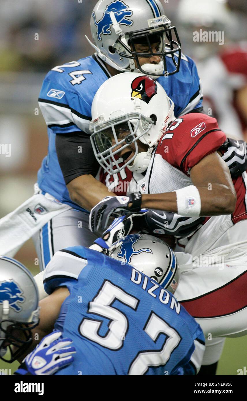Arizona Cardinals' Steve Breaston, center, is stopped by Detroit Lions ...