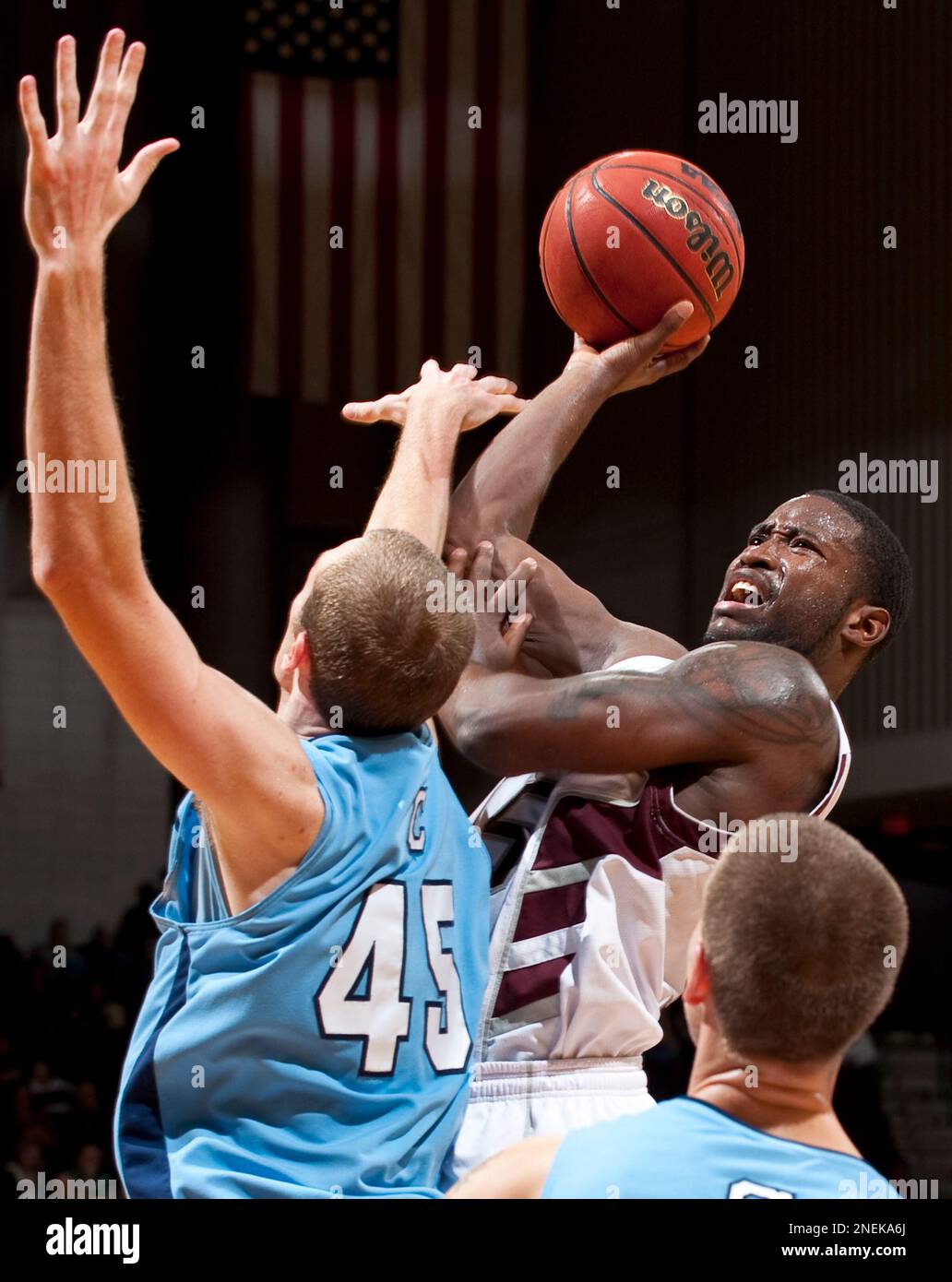 Texas A&M's Donald Sloan, right, shoots over The Citadel's Matt Clark ...
