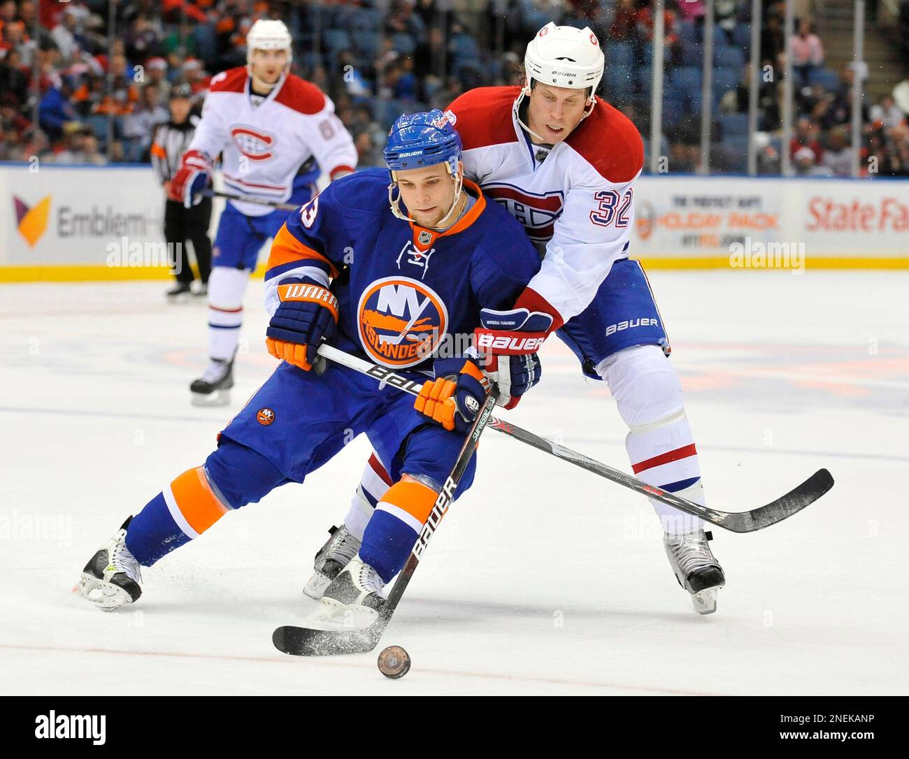 Montreal Canadiens' Travis Moen battles for the puck with New York ...