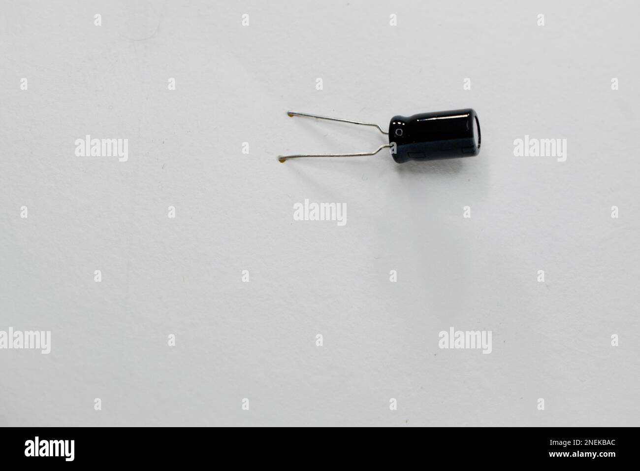 Single piece of capacitor isolated on a white background. Electronic ...