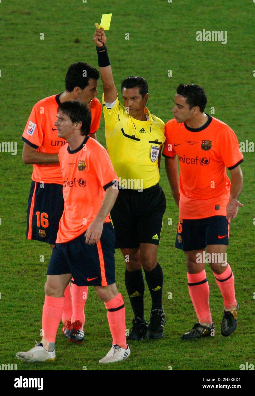 Barcelona's Lionel Messi, foreground left, is shown a yellow card ...