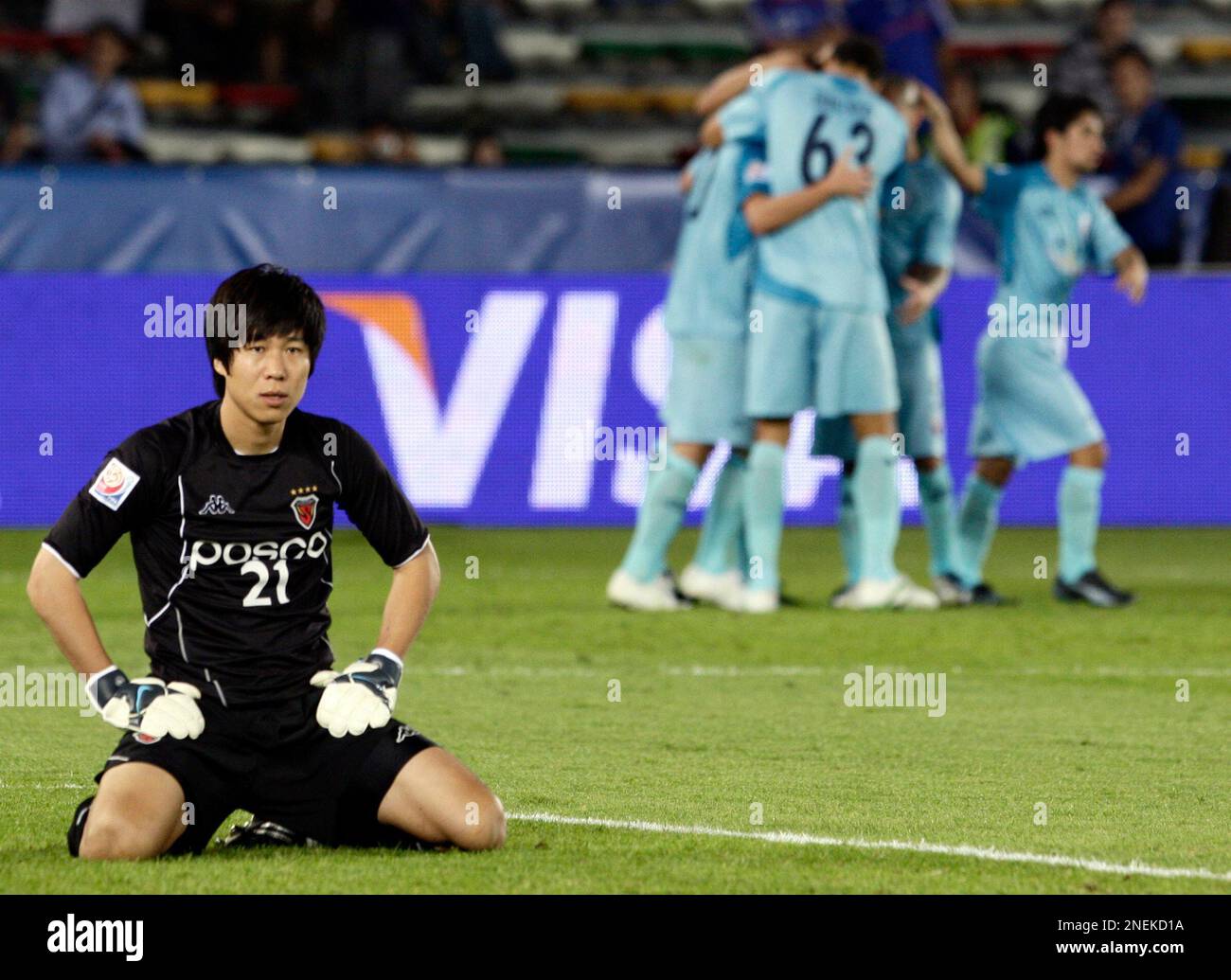 Pohang Steelers goalkeeper Song Dong Jin, left, reacts after Atlante ...