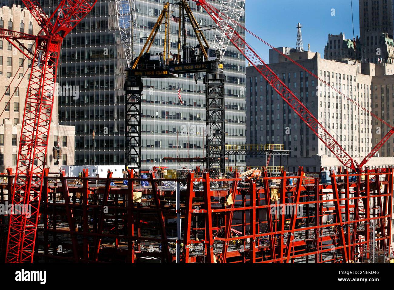 Construction cranes work over the rising steel frame of 1 World Trade ...