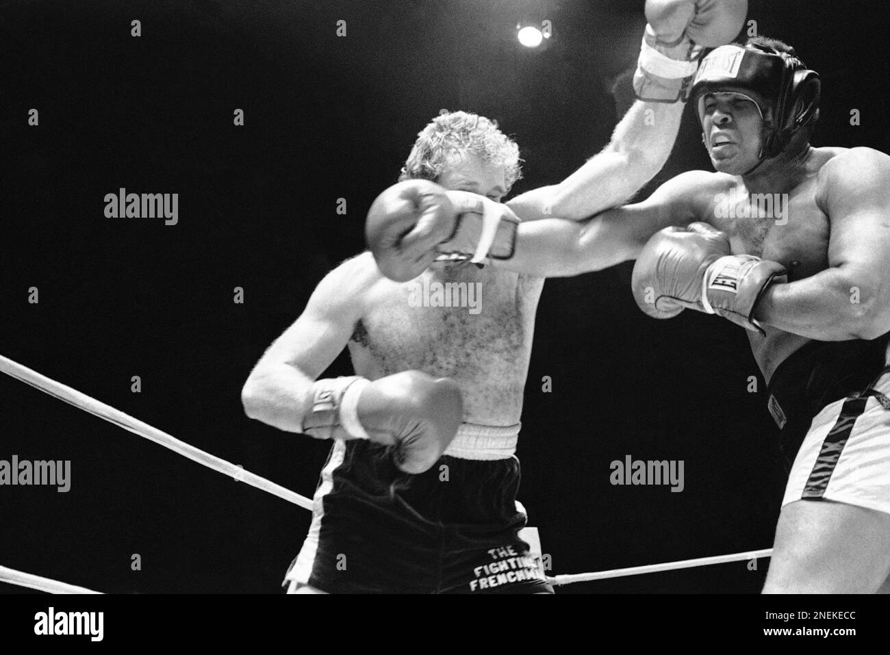 World Heavyweight Champ Muhammad Ali drives a right past nose of ...