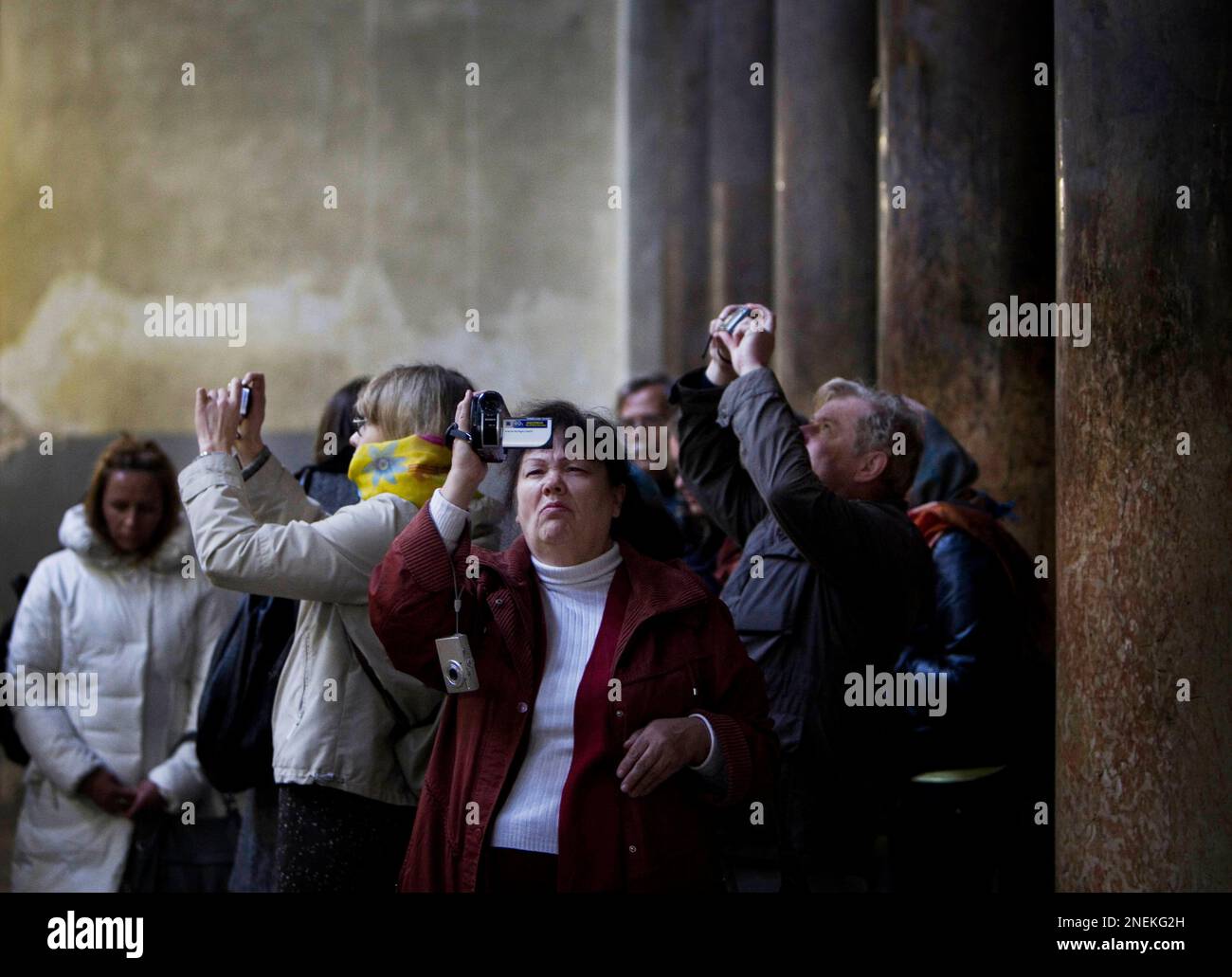 Russian pilgrims take pictures inside the Church of Nativity, believed ...