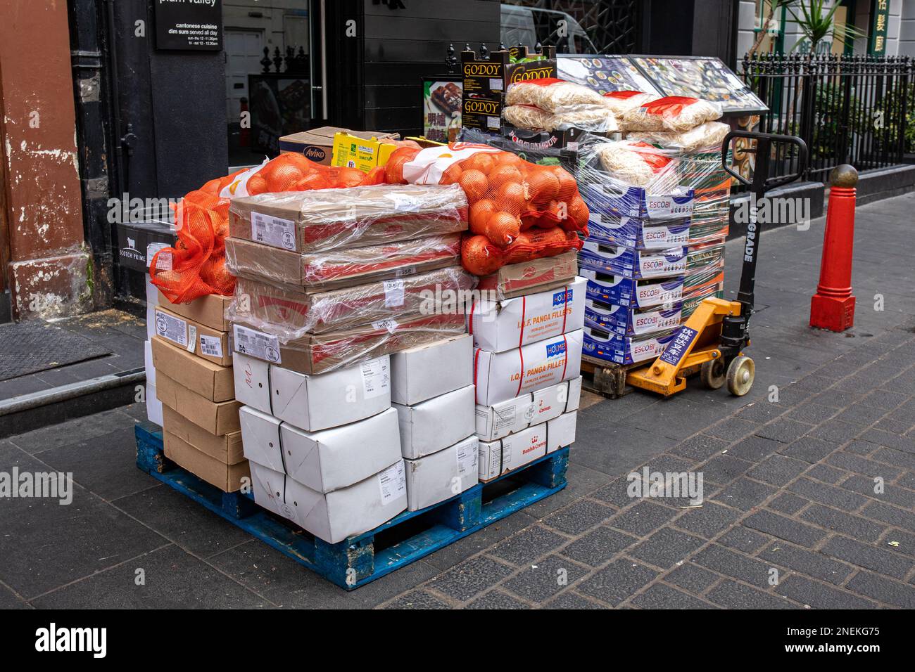 Pallets of ingredients in front of a restaurant in Chinatown of London ...
