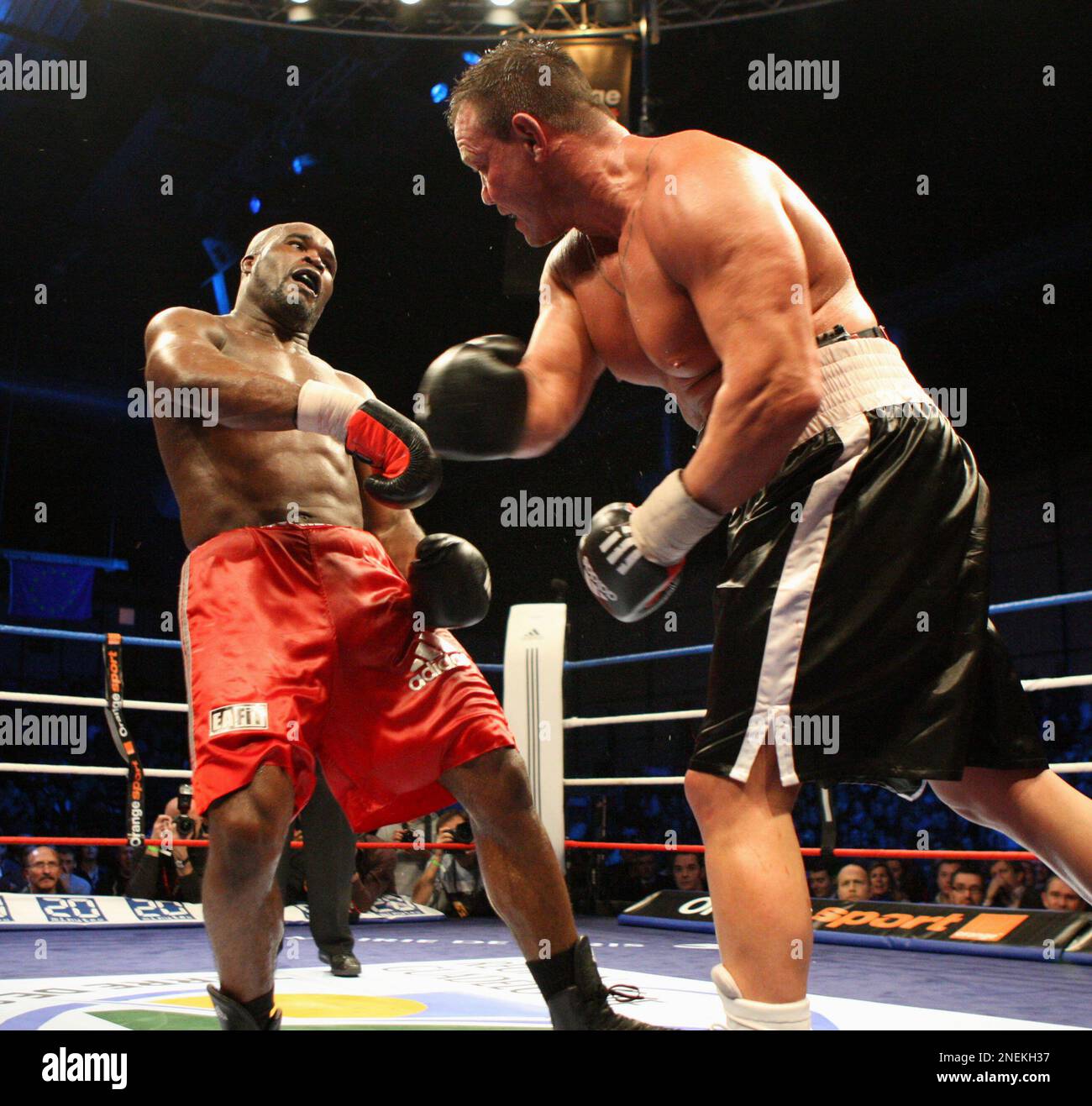 U.S. boxer Vinny Maddalone, right, hits French boxer Jean-Marc Mormeck ...