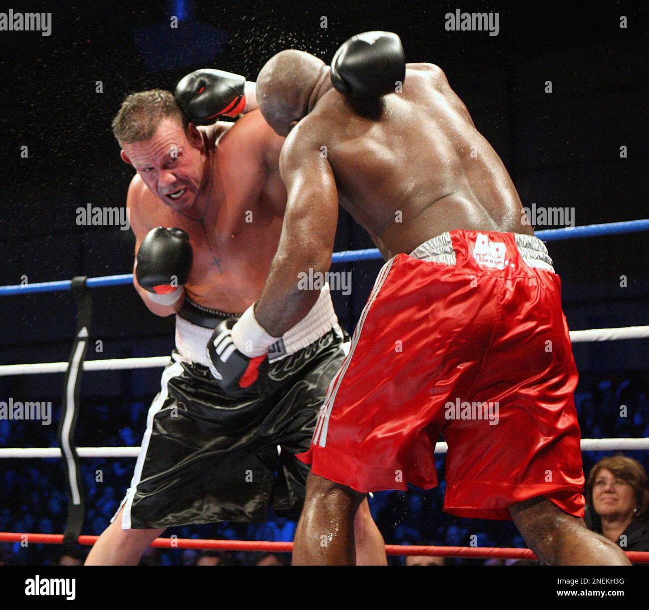 French boxer Jean-Marc Mormeck, right, hits U.S. boxer Vinny Maddalone ...