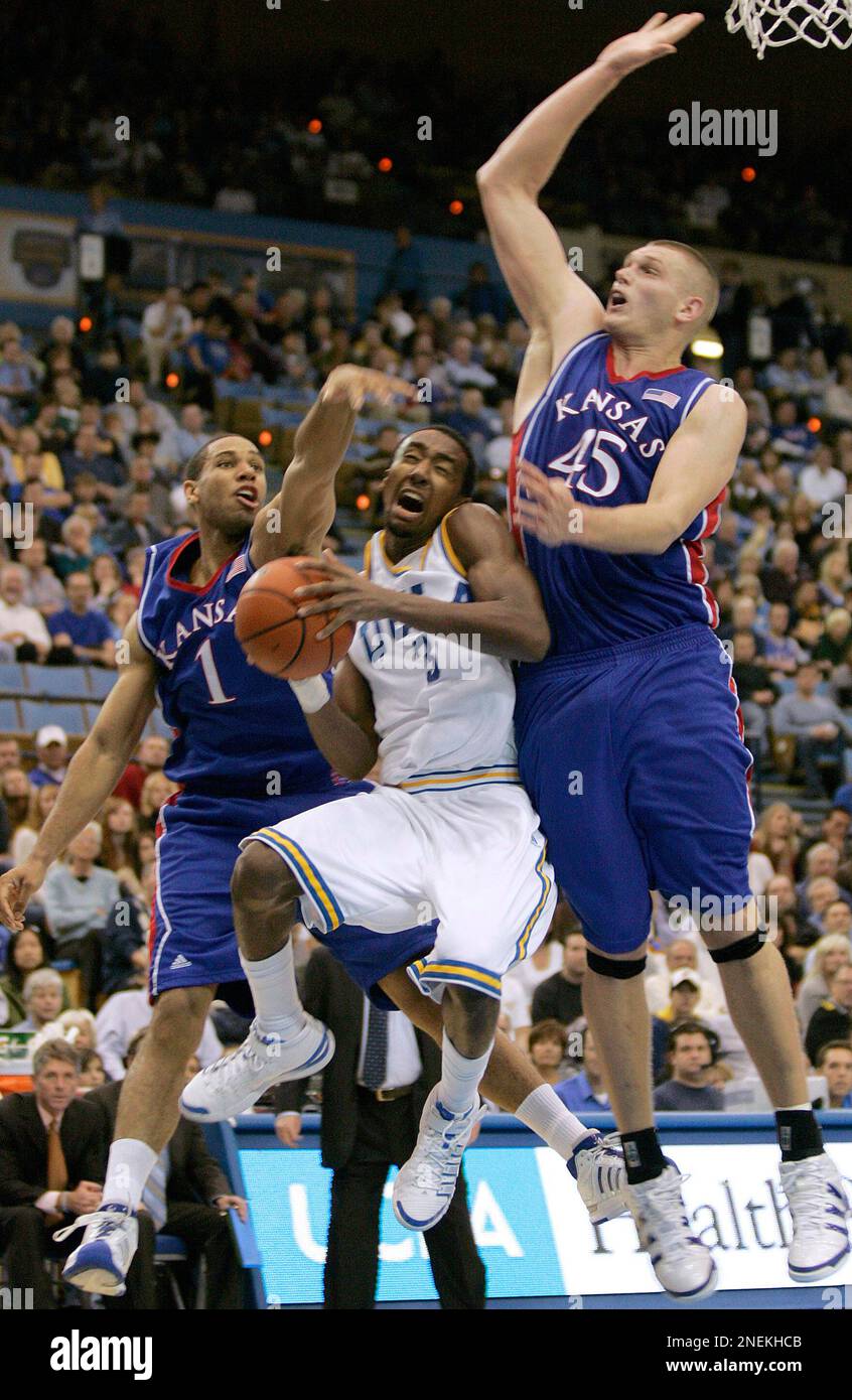 In this Dec. 6, 2009 photo, UCLA guard Malcolm Lee (3) tries to score ...