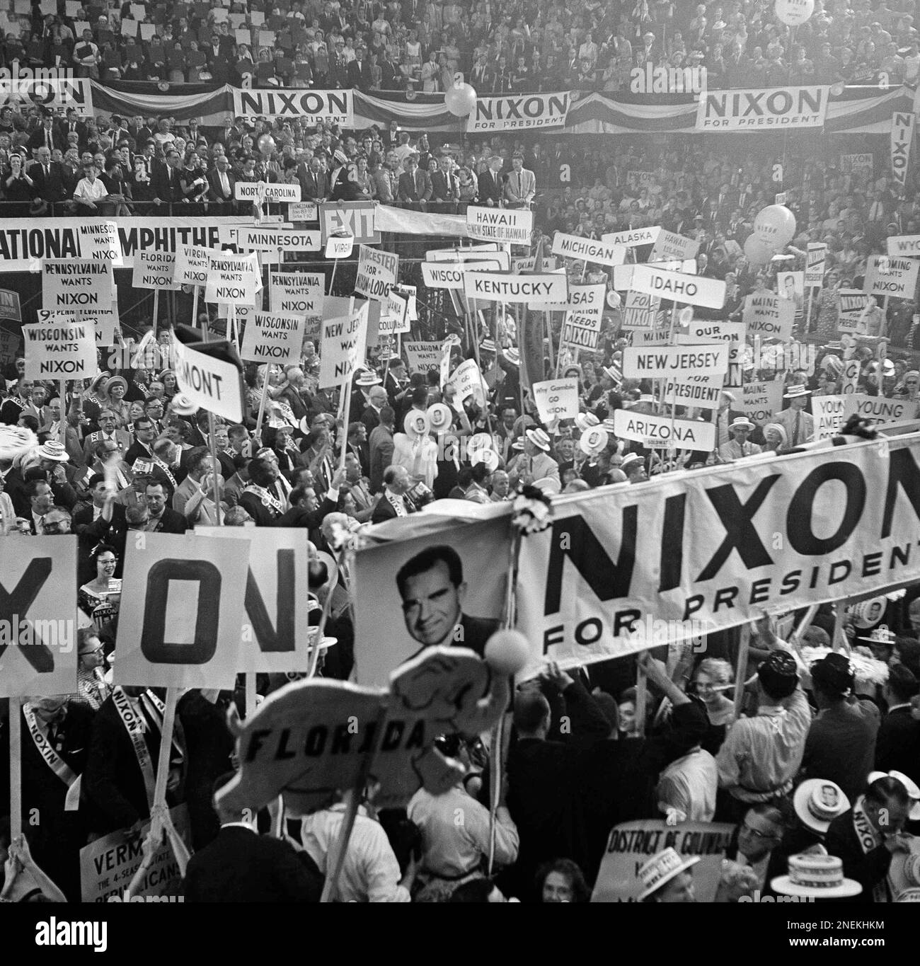It takes several men to handle large Nixon for President sign as ...