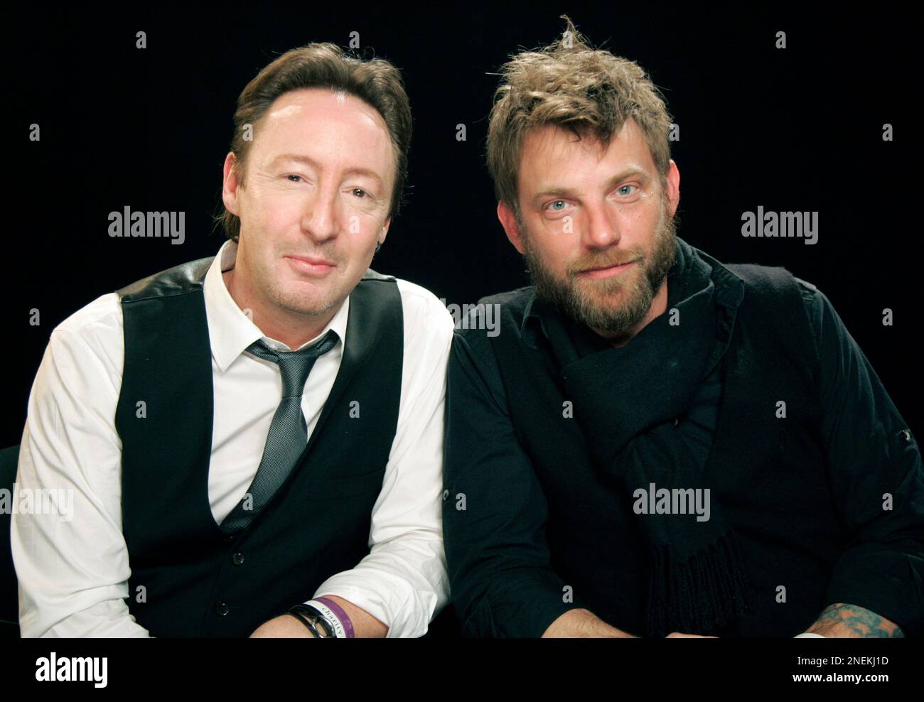 Recording artists Julian Lennon, left, and James Scott Cook pose for a ...