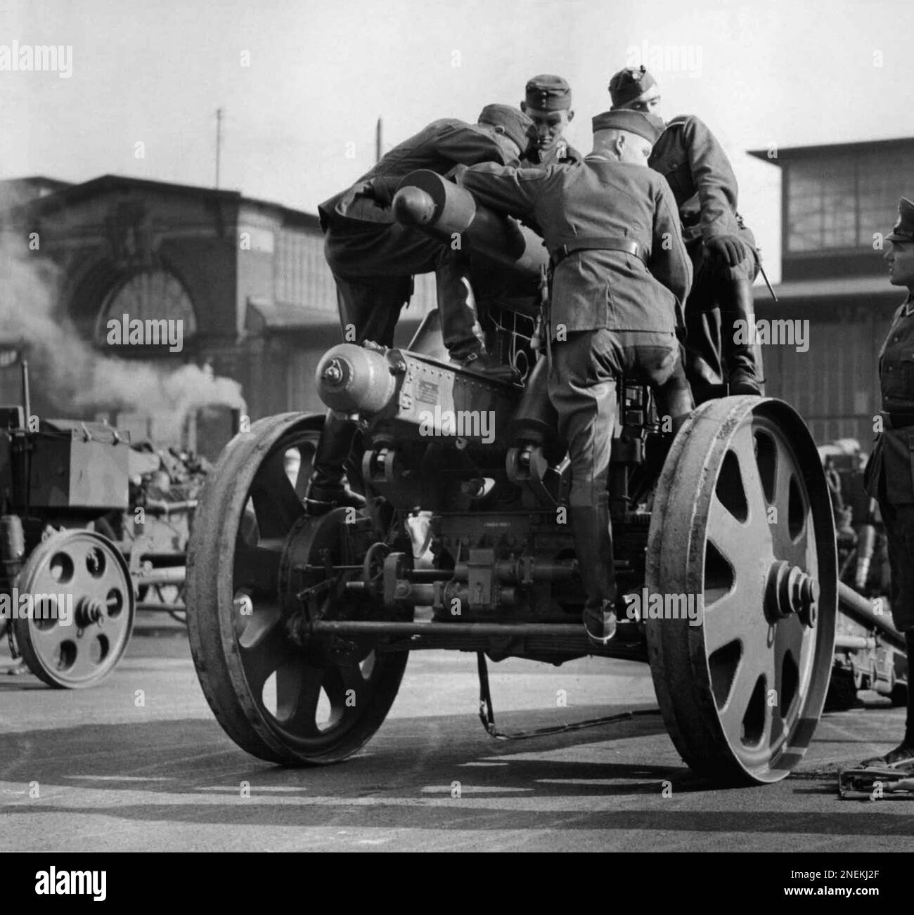 Long Range guns and howitzers, all camouflaged, are shown as they were ...