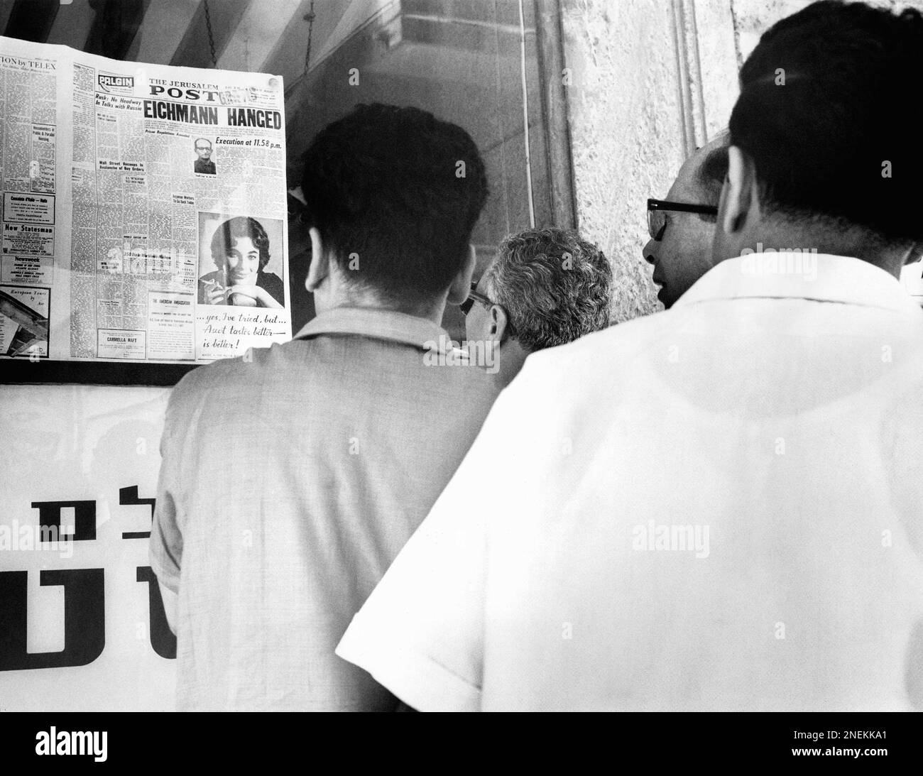 Residents of Tel Aviv, June 1, 1962 read newspaper headlines and ...