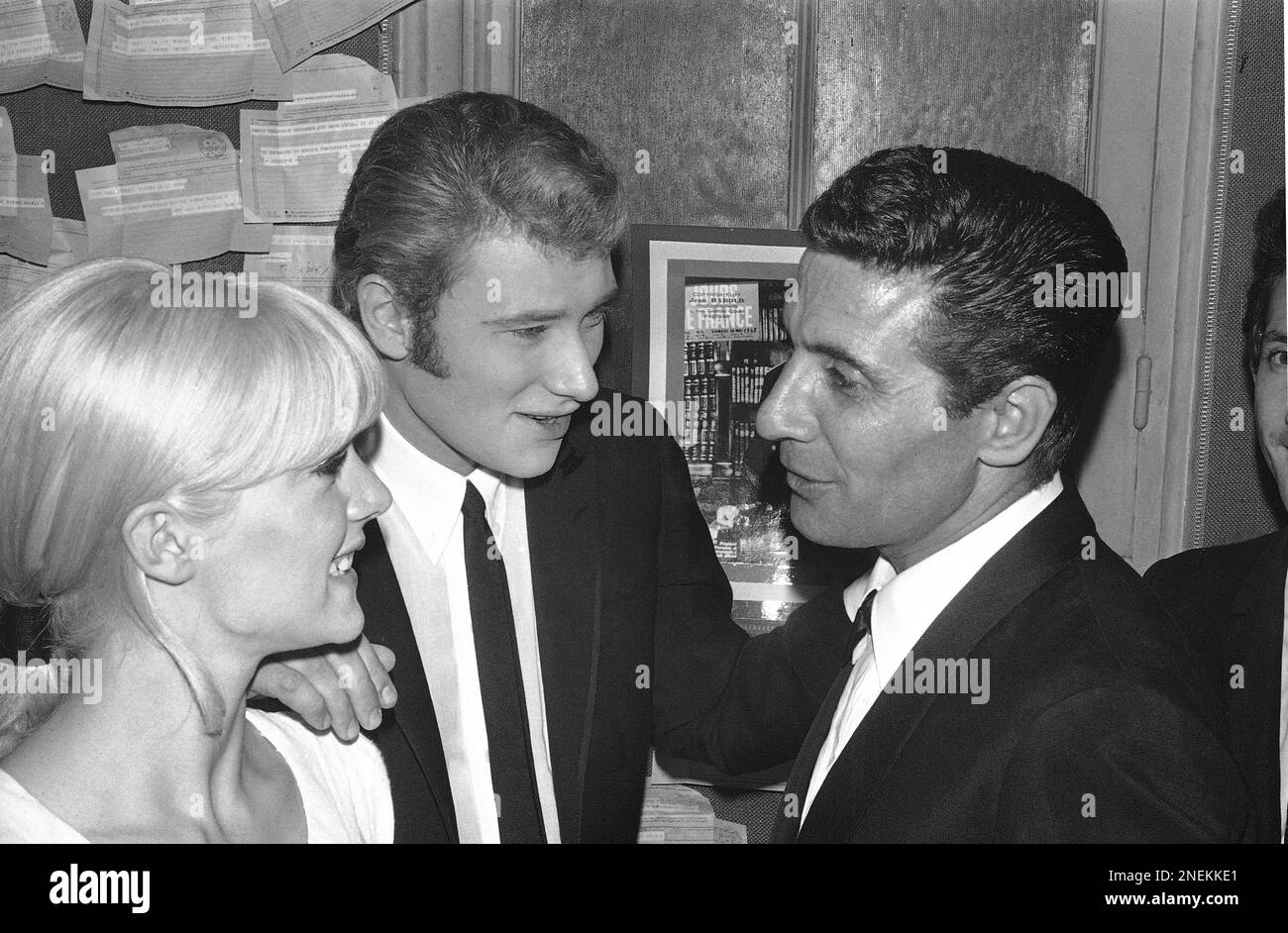 French pop singer Johnny Hallyday is congratulated by singer Gilbert Becaud, right, at the end ...