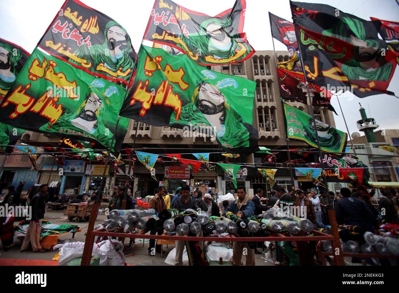 Shiite Muslims shop for religious flags of Imam Hussein during Muharram ...