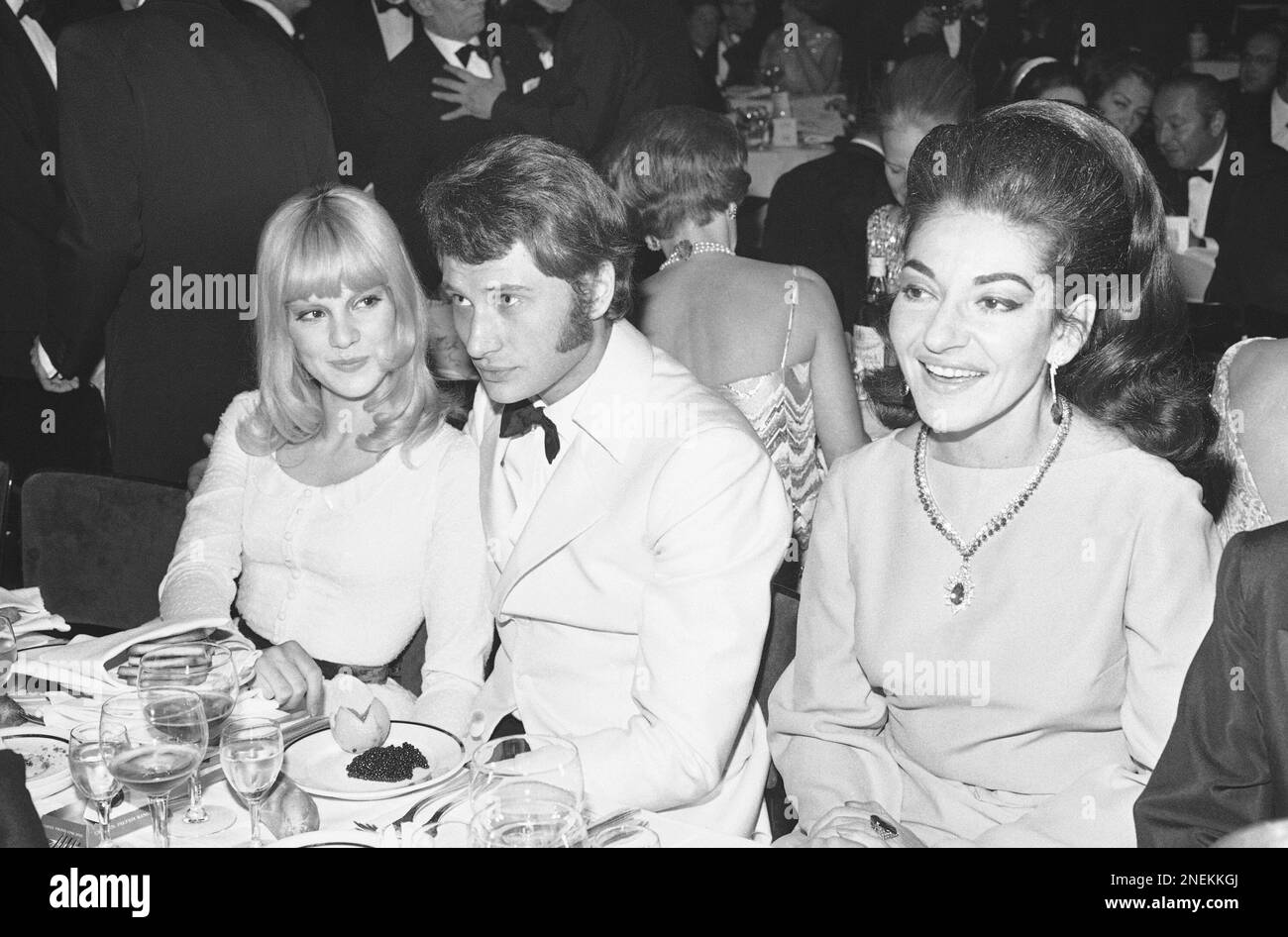 Pop singers Johnny Hallyday and his wife, Sylvie Vartan at left, are shown with Opera singer ...