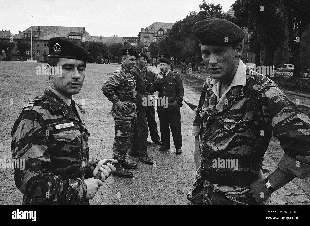 Sergeant Johnny Hallyday of the French Marines straddles a tank in ...