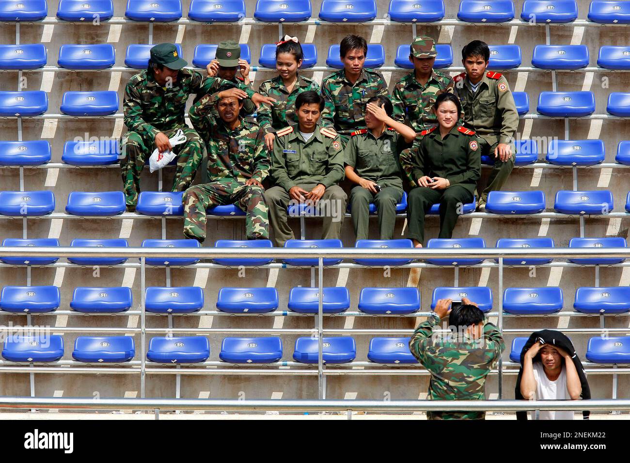Soldiers and security personnel sit in the stadium stands to watch the ...