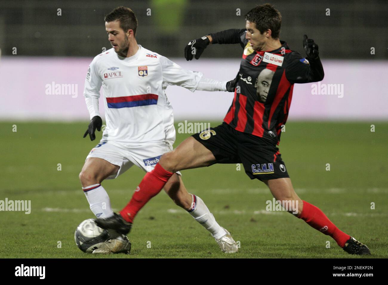 Lyon's Miralem Pjanic, left, challenges for the ball with Boulogne's ...