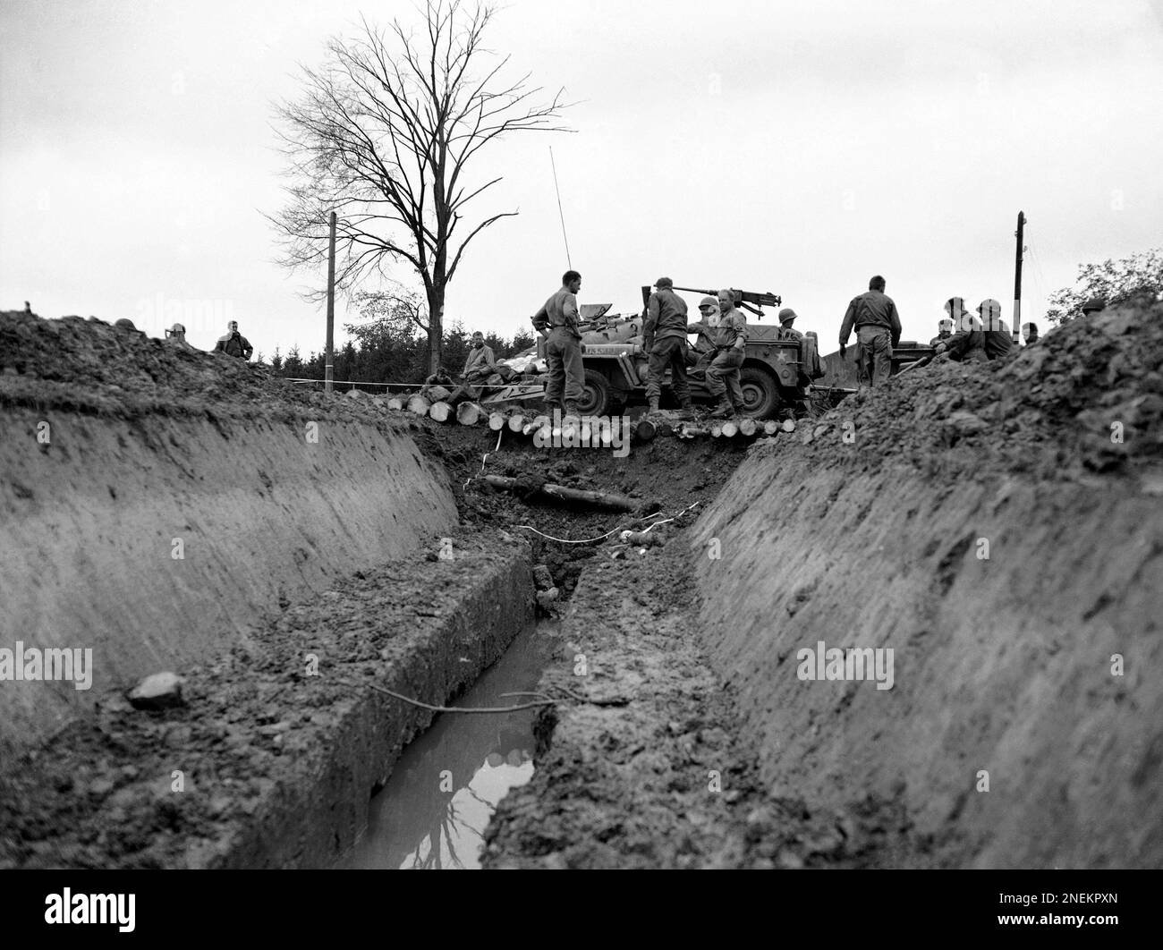 An American jeep crossing a 15 foot tank traps across the Siegfried ...