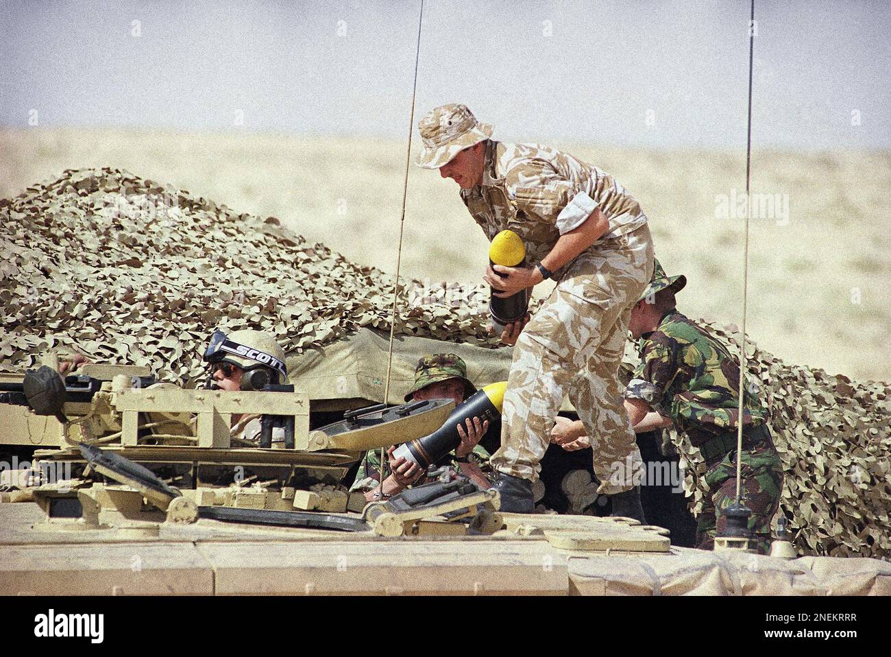Soldiers form the 7 Armoured Brigade Desert Rats load 120mm shells into ...