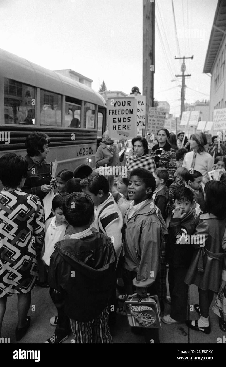 Parents in background carry signs protesting San Francisco?s program of ...