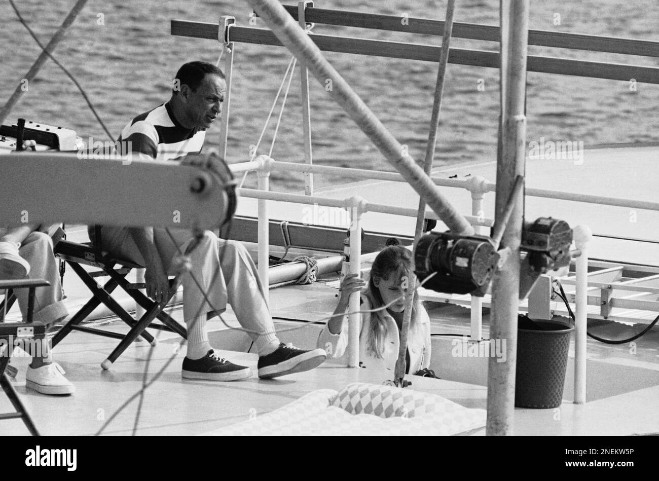 TV actress Mia Farrow heads below under the watchful eye of Frank ...