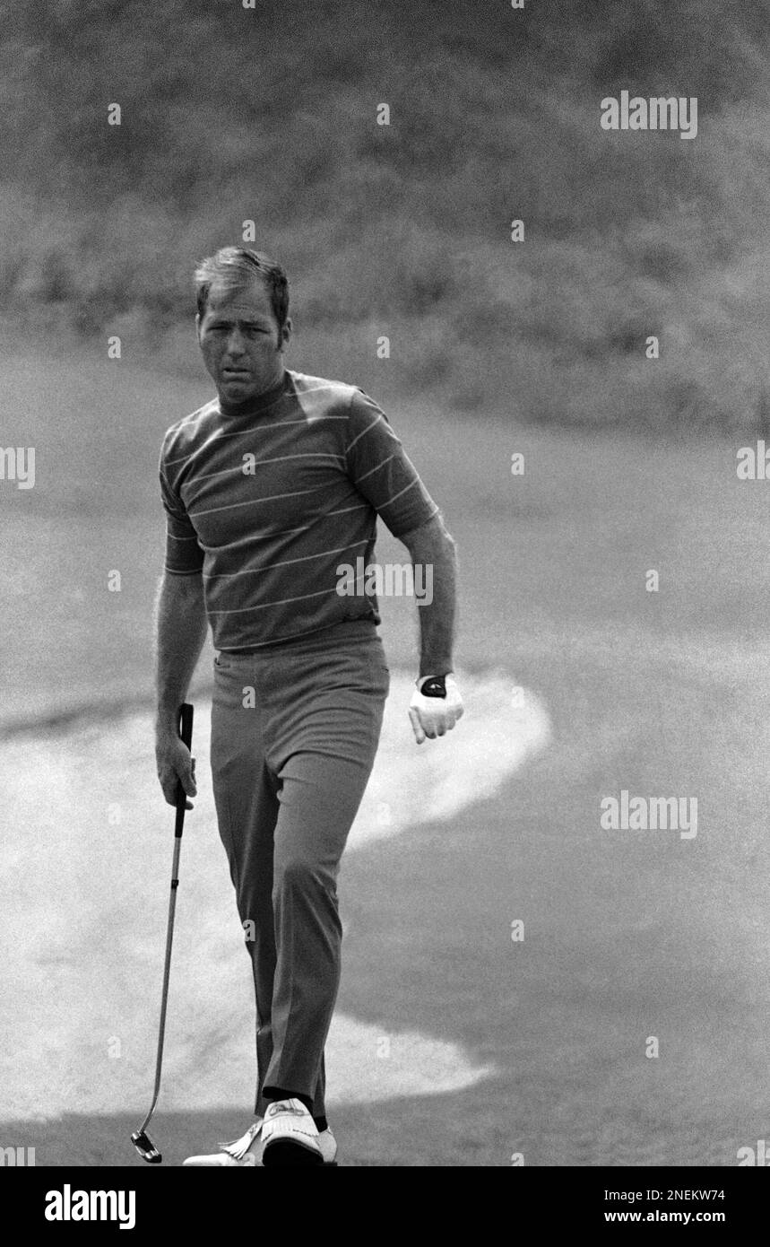 Green Bay Packer Quarterback Bart Starr looks after a putt that did not ...