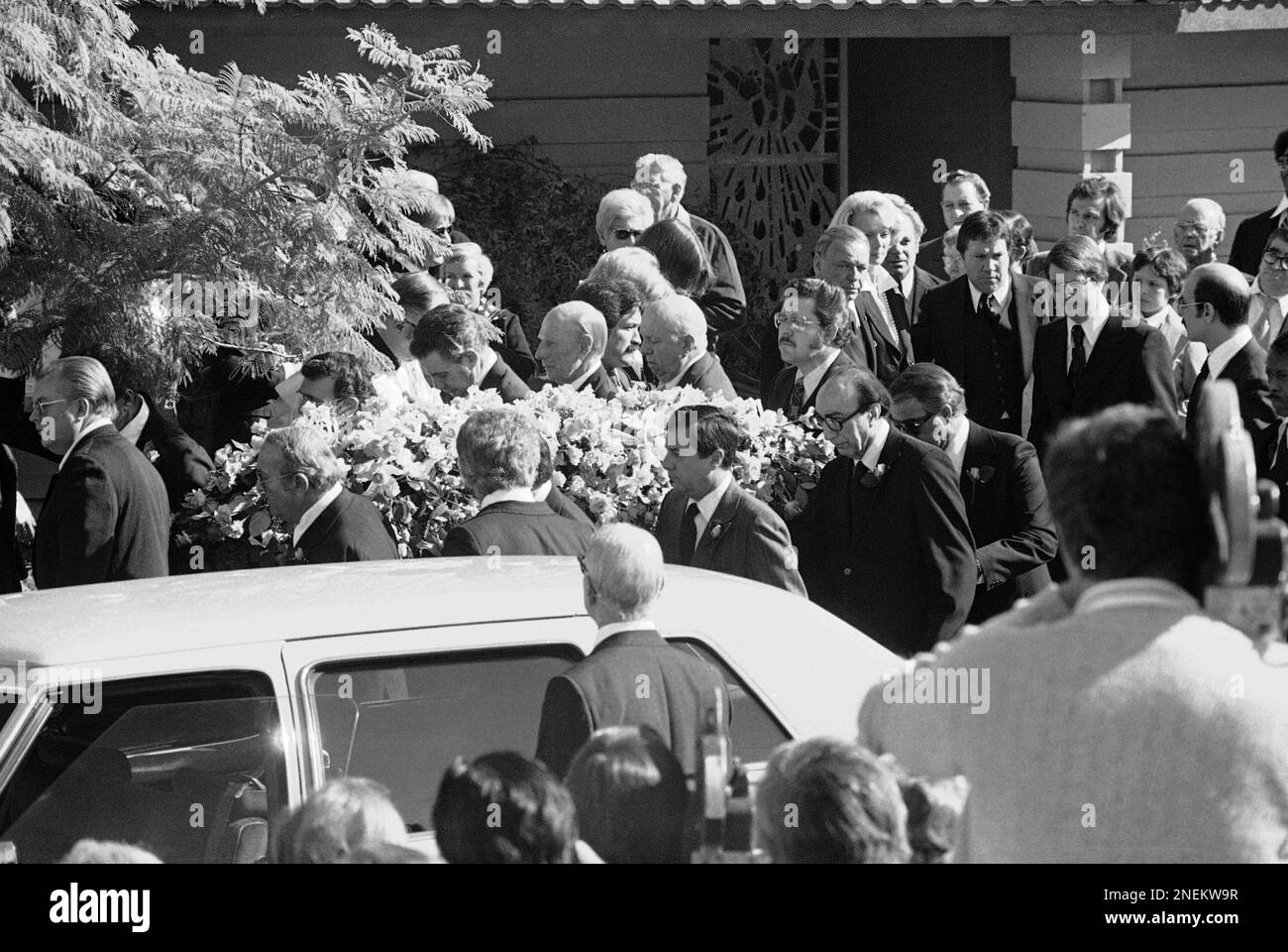 Frank Sinatra and his wife Barbara, far right, watch as his mother?s casket is carried from ...