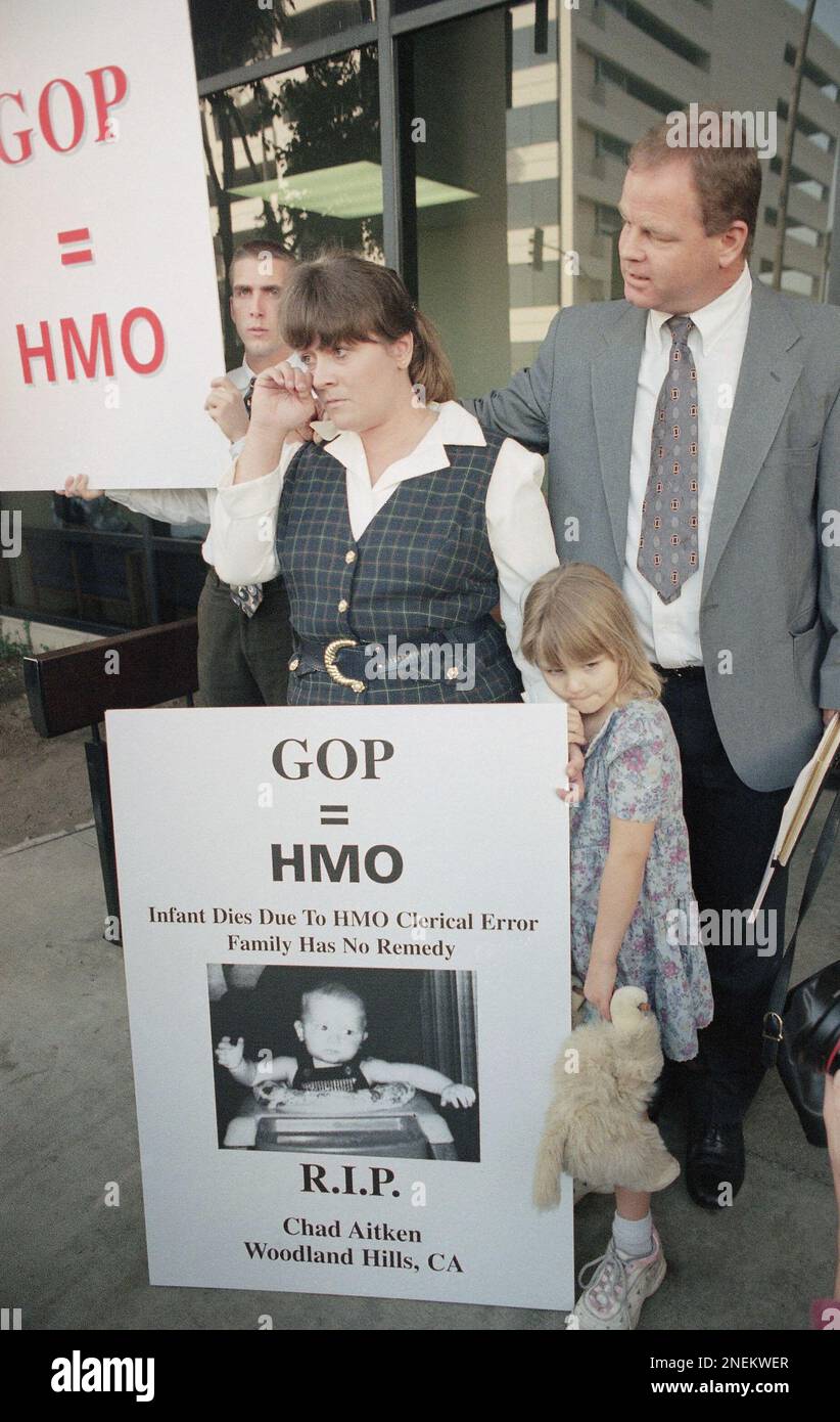 Heather Aitken is comforted by her husband Douglas during an anti ...