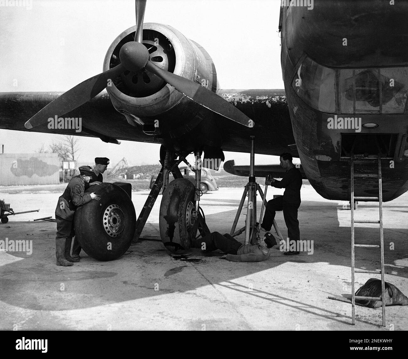Some of the Royal Air Force mechanics, boys in the back room, stripping ...