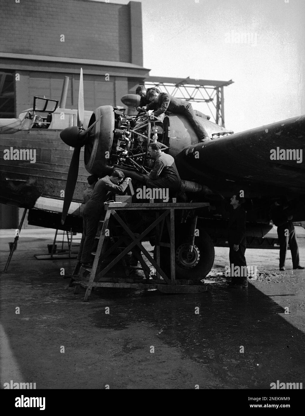 Some of the Royal Air Force mechanics, boys in the back room, stripping ...