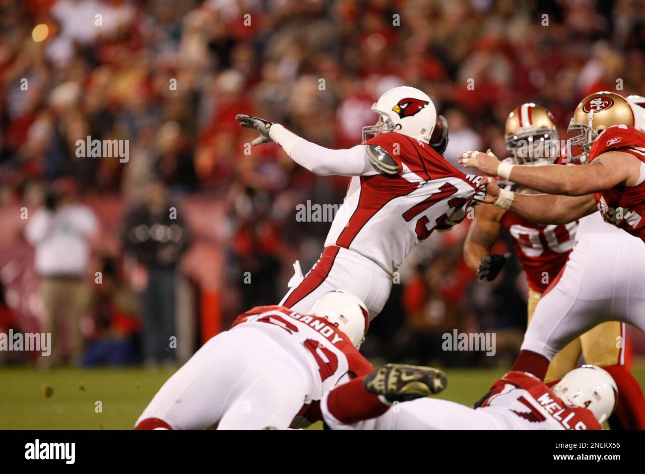 Arizona Cardinals quarterback Kurt Warner (13) is brought down by San ...