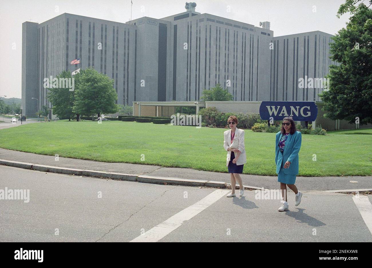 Two Wang employees leaving for lunch break outside Wang Headquarters in ...