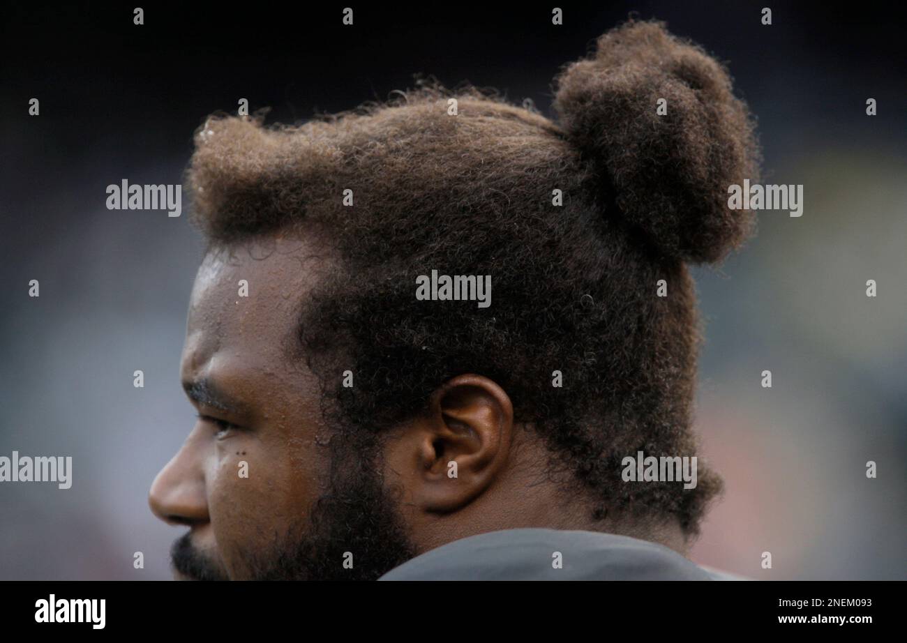 Oakland Raiders defensive tackle Gerard Warren (61) is shown during an ...