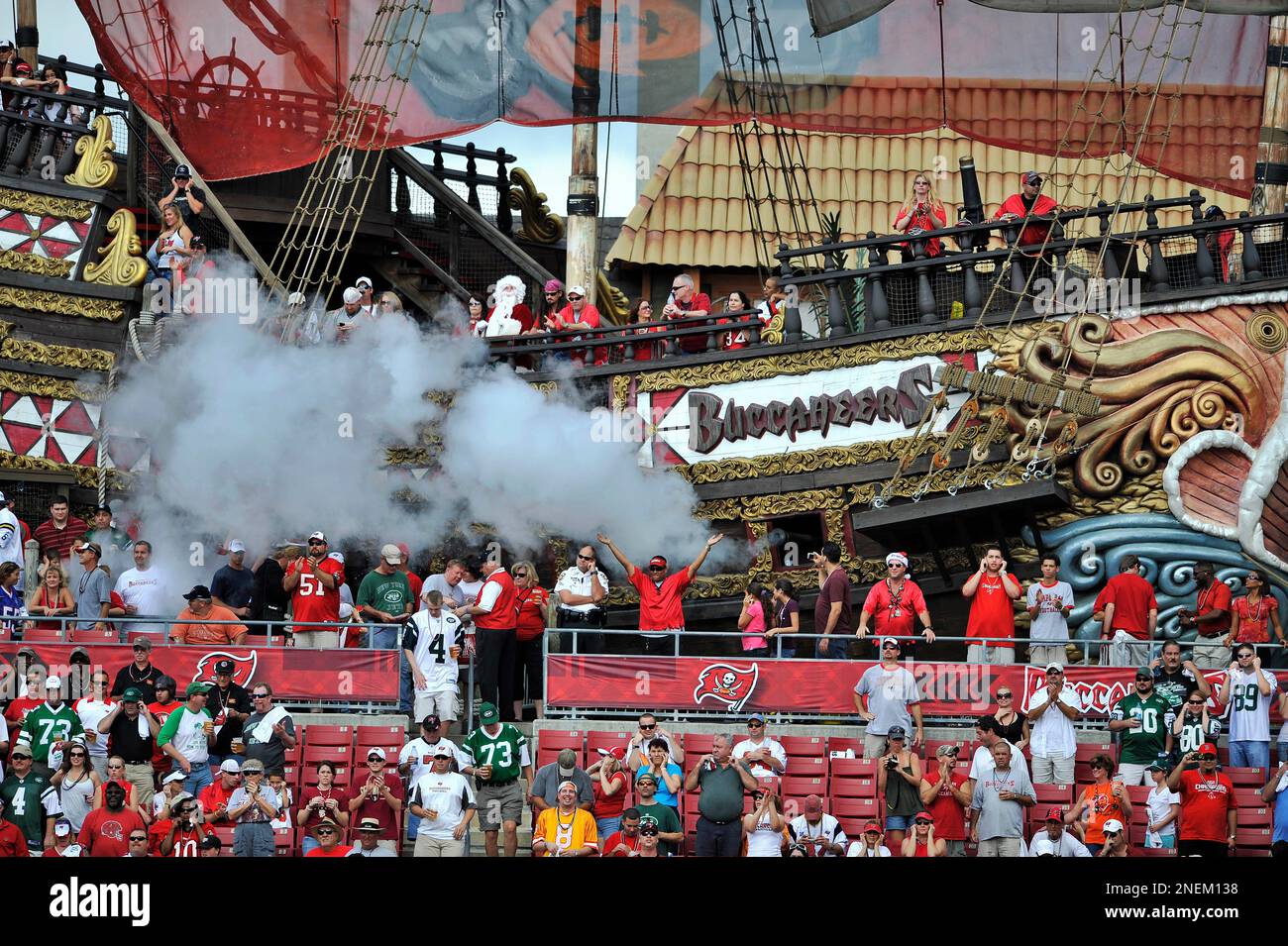 Fans cover their ears as cannons fire from the pirate ship at Raymond ...