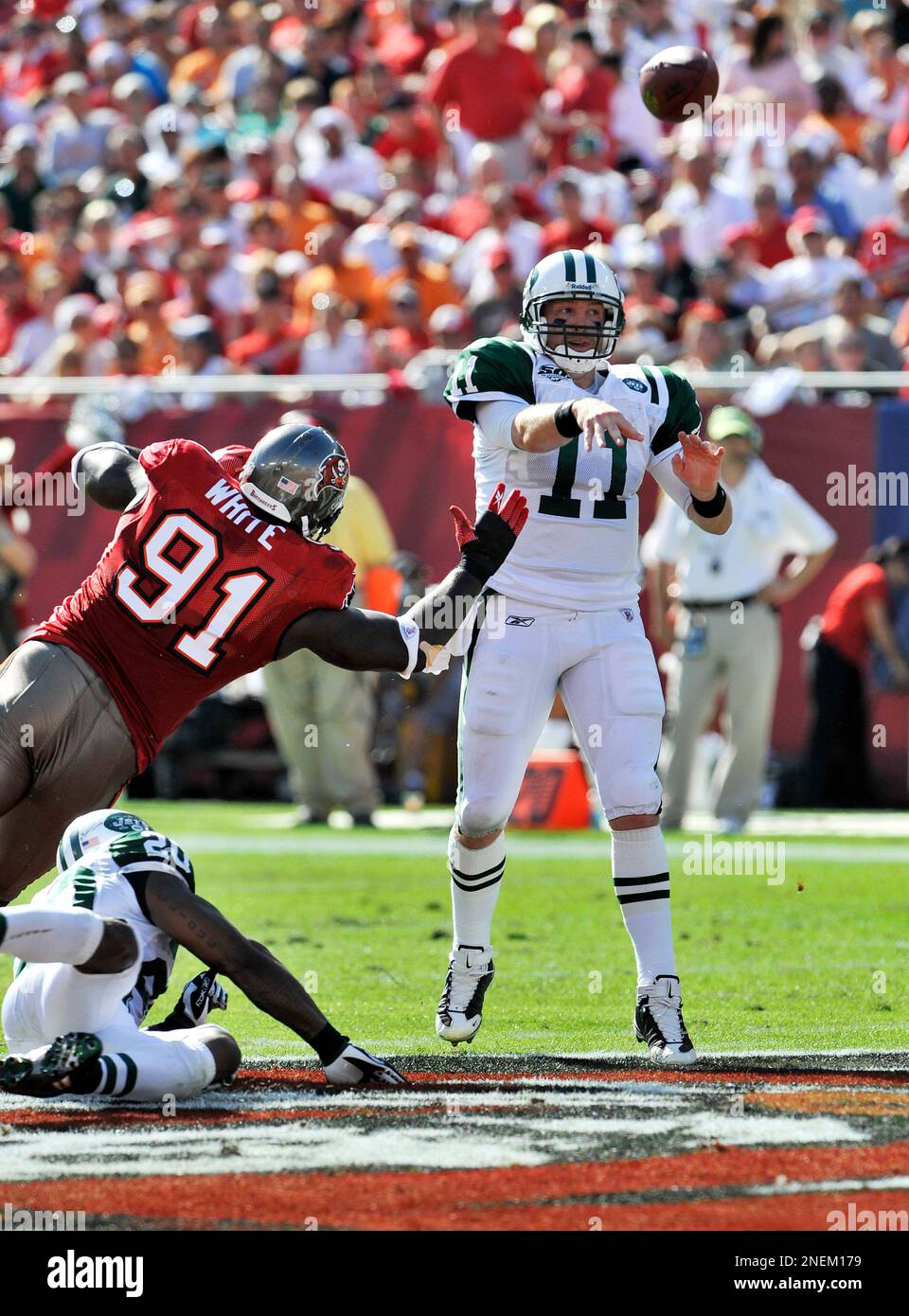 New York Jets quarterback Kellen Clemens (11) passes under pressure ...